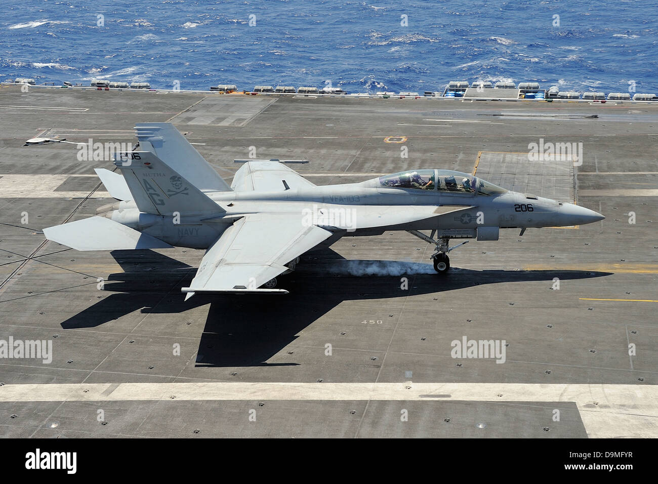 An F/A-18 Hornet of the U.S. Navy landing aboard USS Eisenhower Stock ...