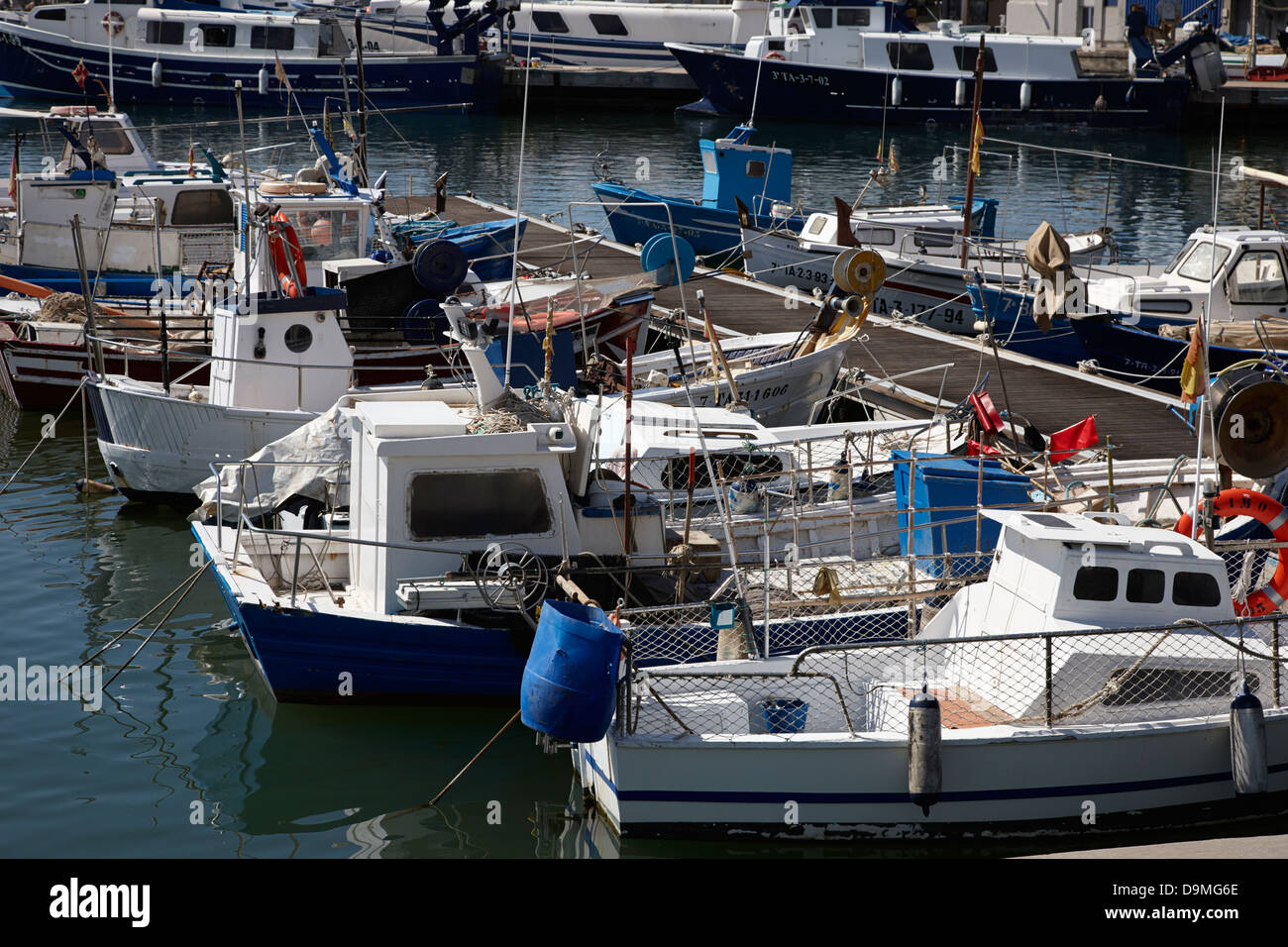 small inshore fishing boats in the port harbour of Cambrils Catalonia ...