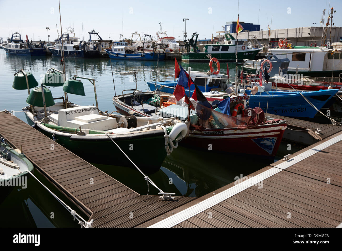 small inshore fishing boats in the port harbour of Cambrils Catalonia ...