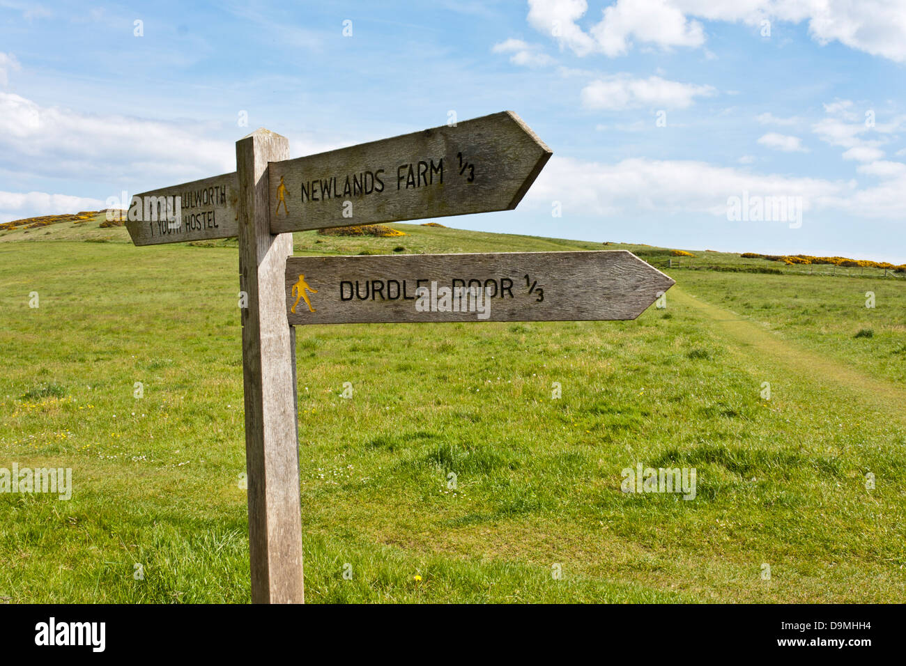 Wooden sign on the south west coast path at Durdle Door, Dorset Stock ...