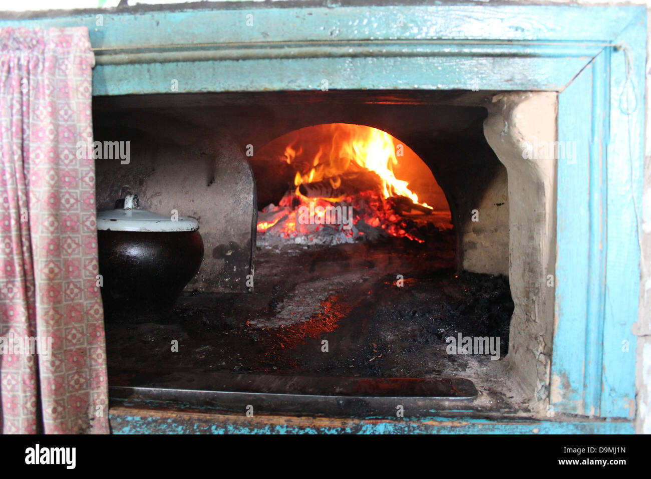 the food cooking in the pig-iron in furnace Stock Photo - Alamy