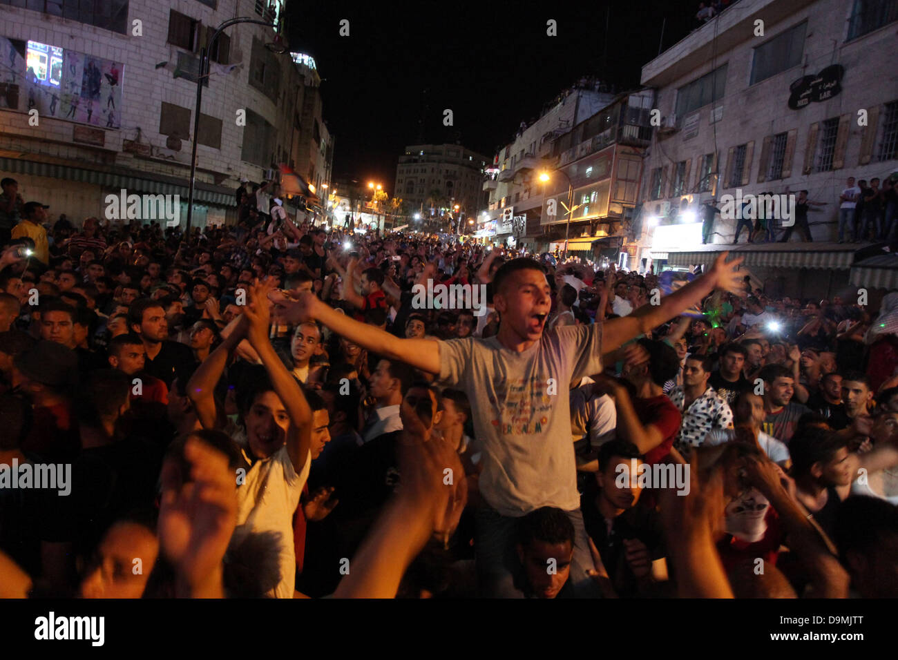 June 23, 2013 - Ramallah, West Bank - Palestinians crowd the streets to ...