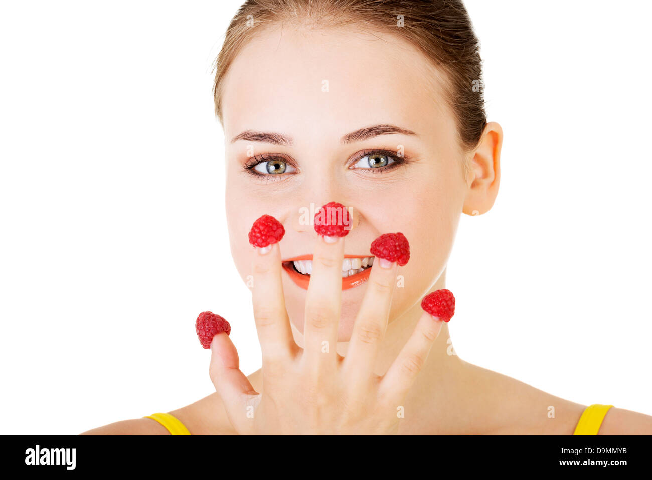 Smiling casual woman with raspberries, isolated on white Stock Photo ...
