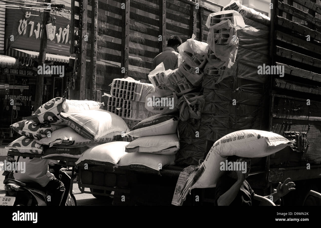 Man carrying rice bags hi-res stock photography and images - Alamy