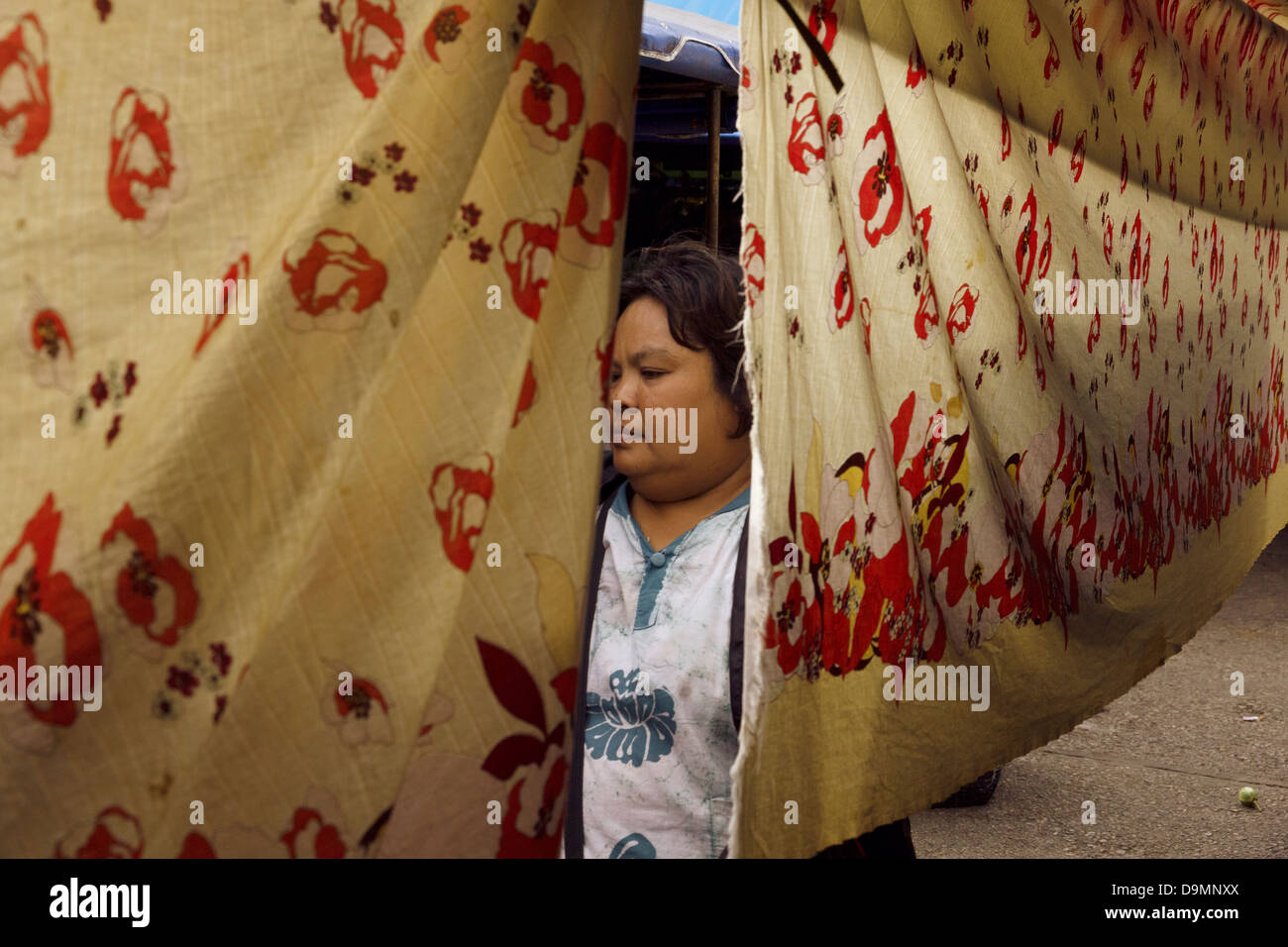 Woman and hanging sheets hi-res stock photography and images - Alamy