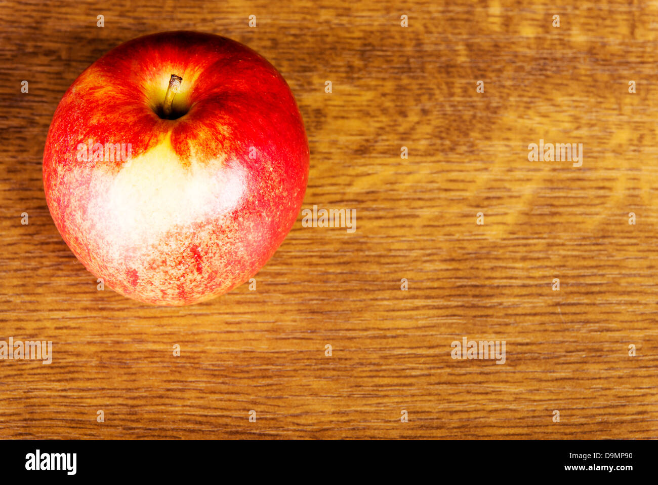 Apple on wooden table Stock Photo - Alamy