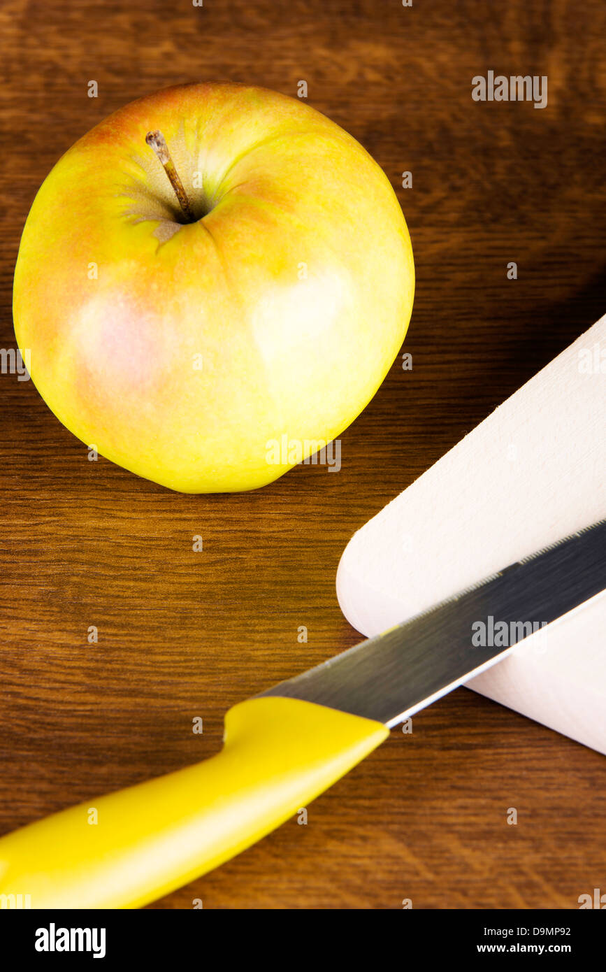 Apple on wooden table Stock Photo - Alamy