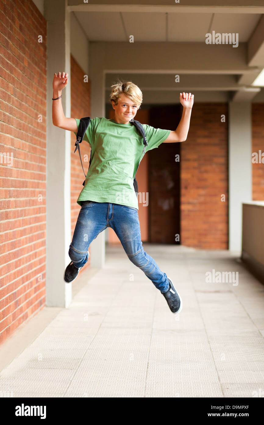 happy male high school student jumping up in school Stock Photo - Alamy