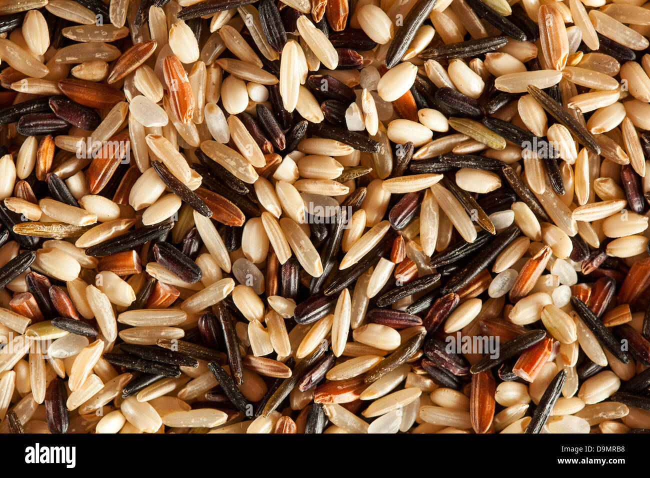 Organic Dry Multi Grain Rice against a background Stock Photo - Alamy