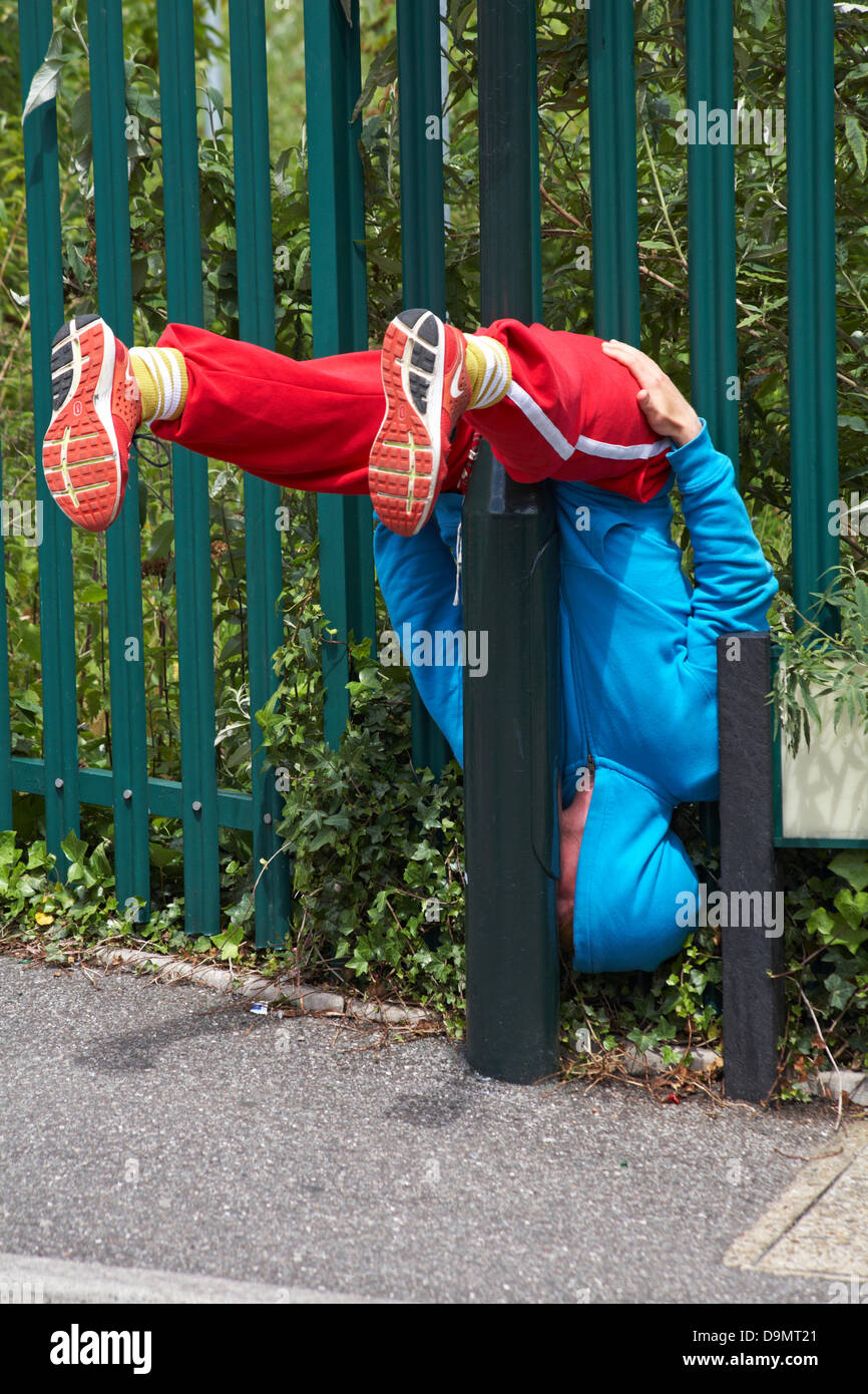 Person stuck between railings hi-res stock photography and images - Alamy