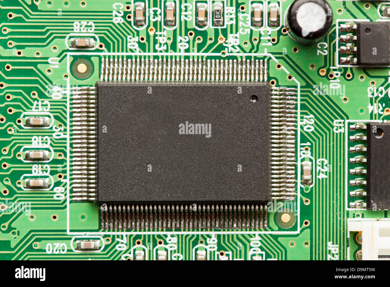 Green Electrical Circuit Board with microchips, conductors, and ...