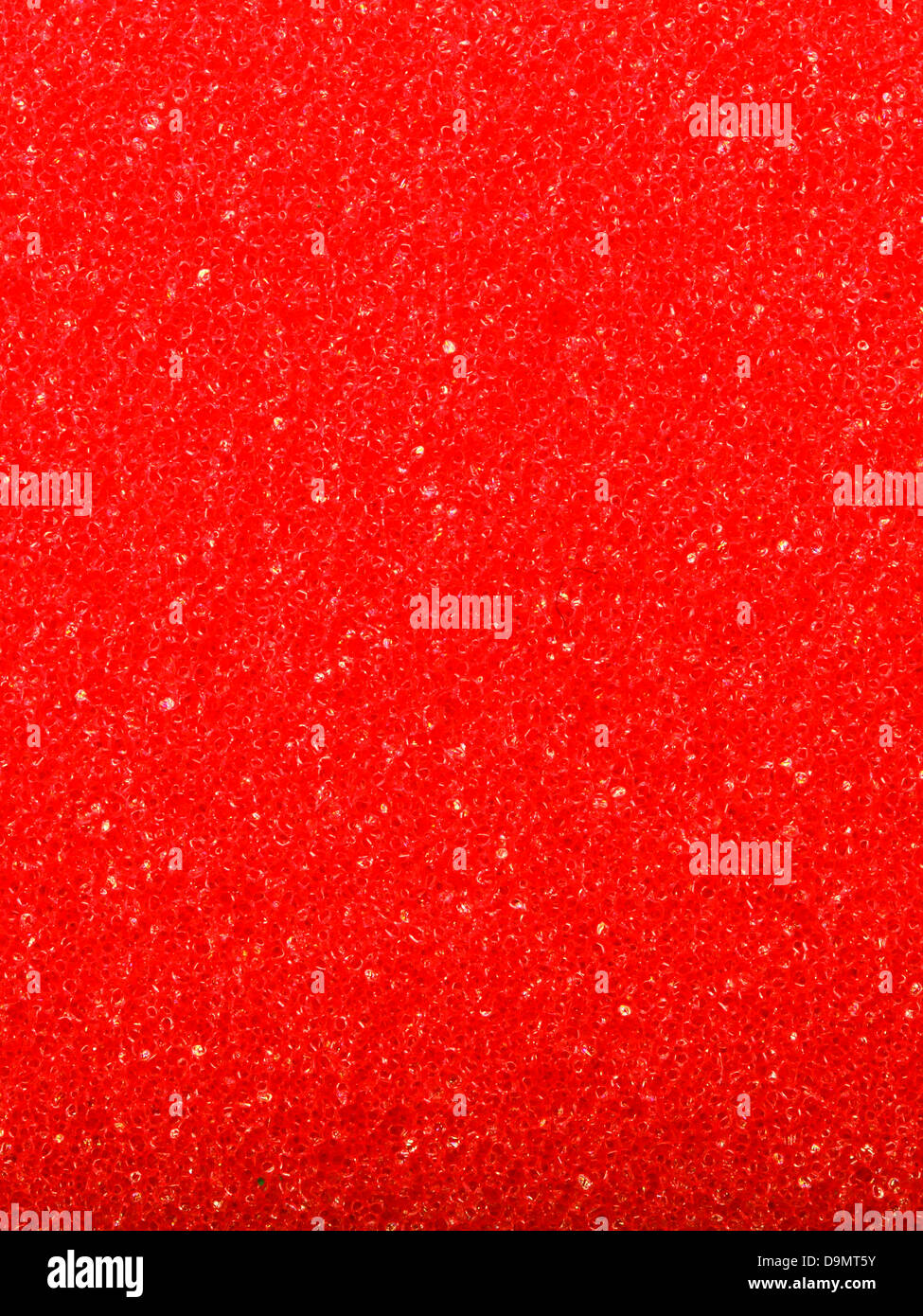 Red texture cellulose foam sponge - background Stock Photo - Alamy