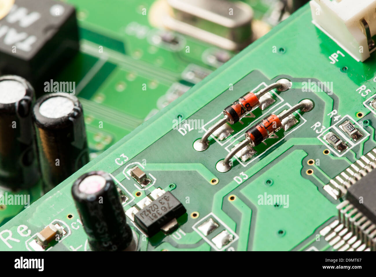 Green Electrical Circuit Board with microchips, conductors, and ...