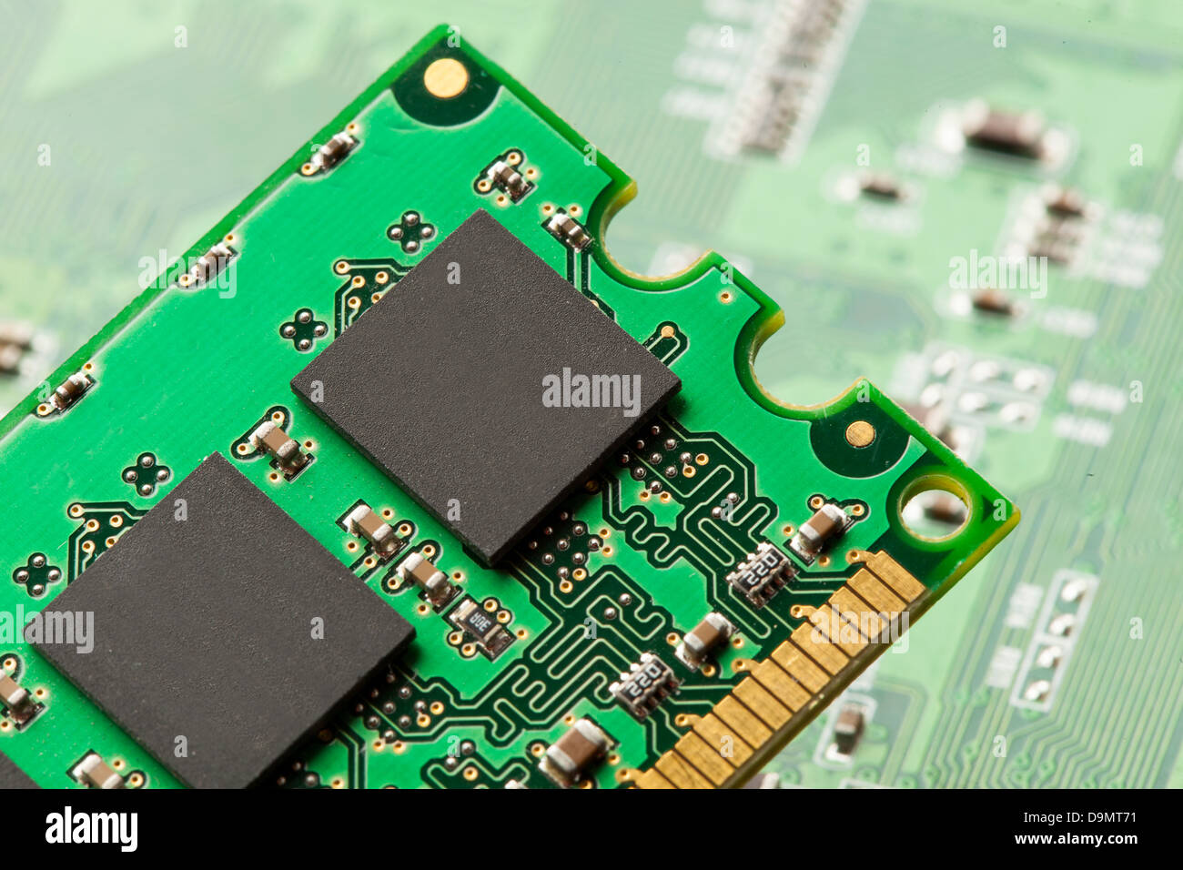 Green Electrical Circuit Board with microchips, conductors, and ...
