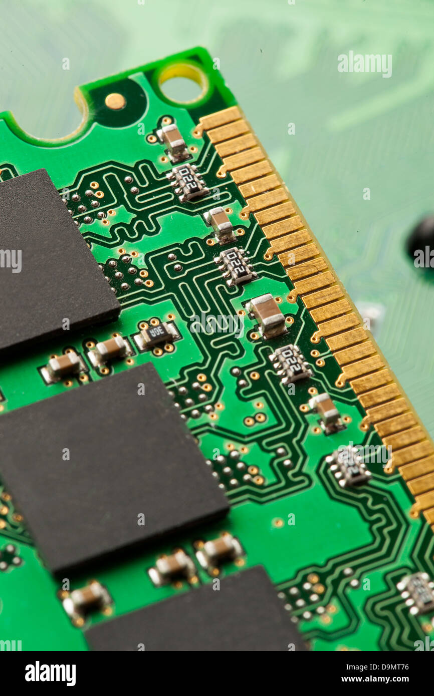 Green Electrical Circuit Board with microchips, conductors, and ...