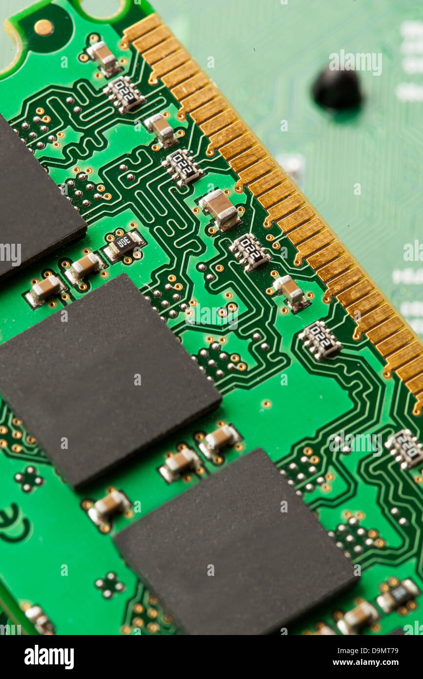 Green Electrical Circuit Board with microchips, conductors, and ...