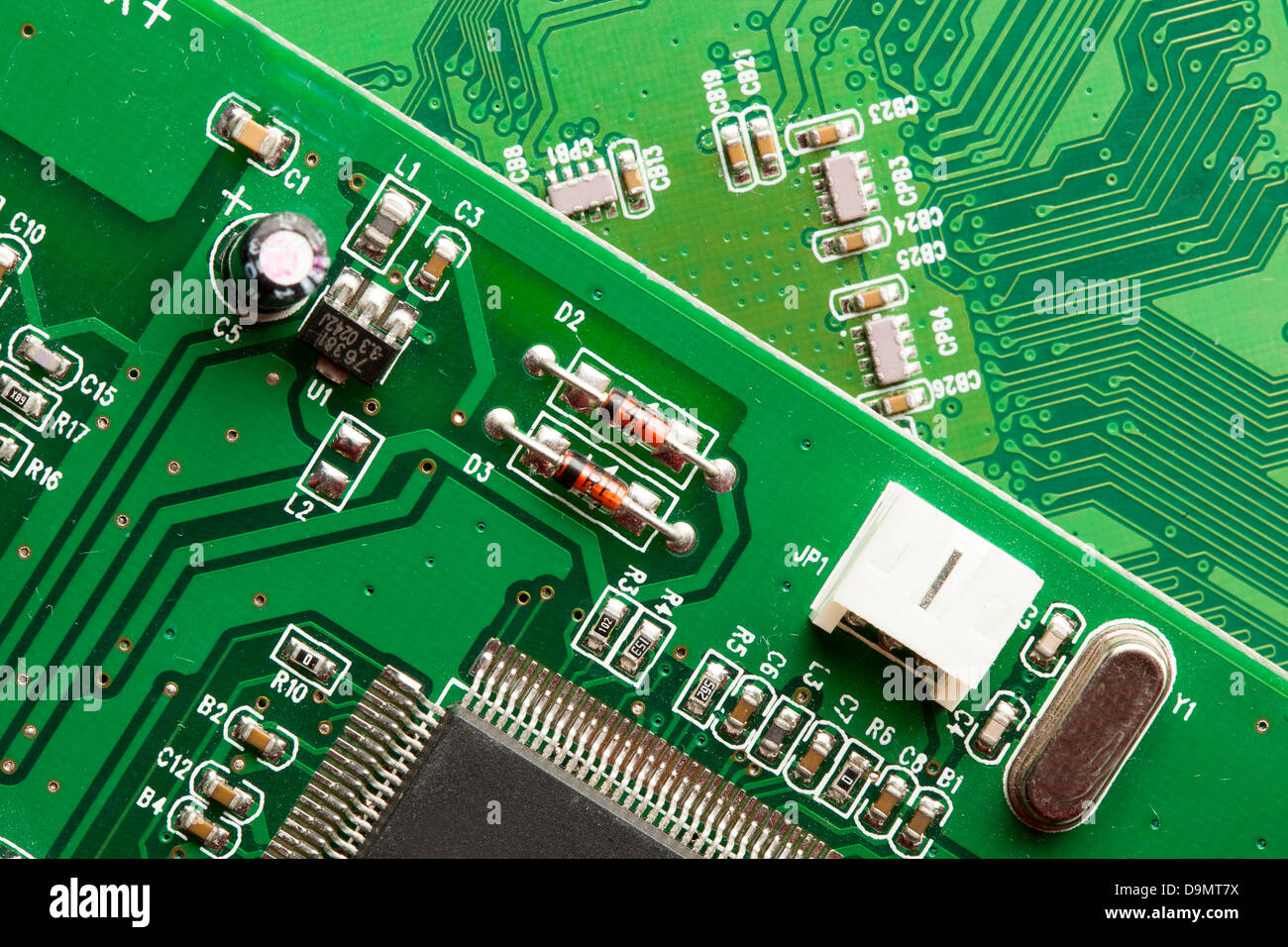 Green Electrical Circuit Board with microchips, conductors, and ...