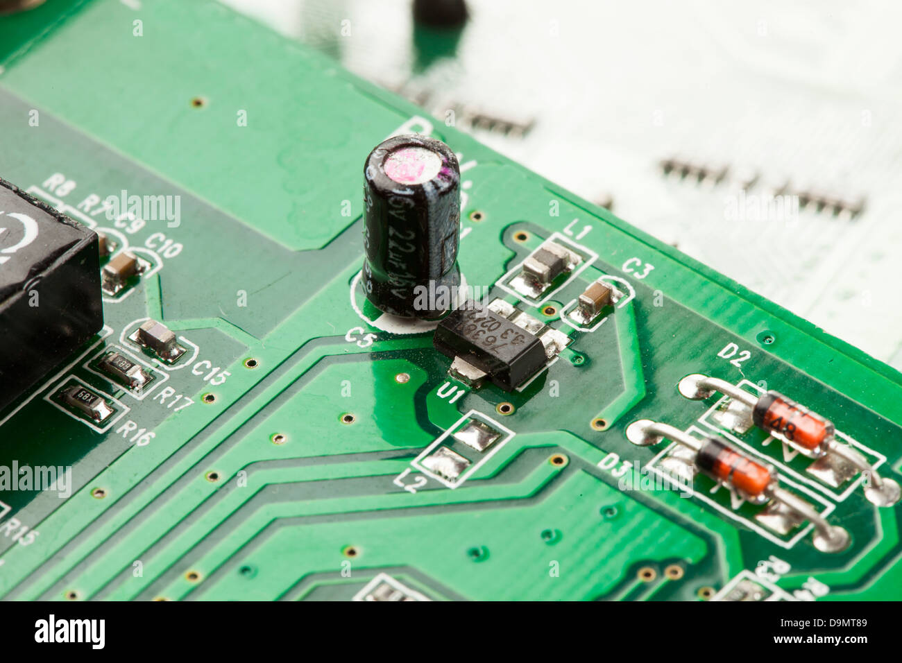 Green Electrical Circuit Board with microchips, conductors, and ...