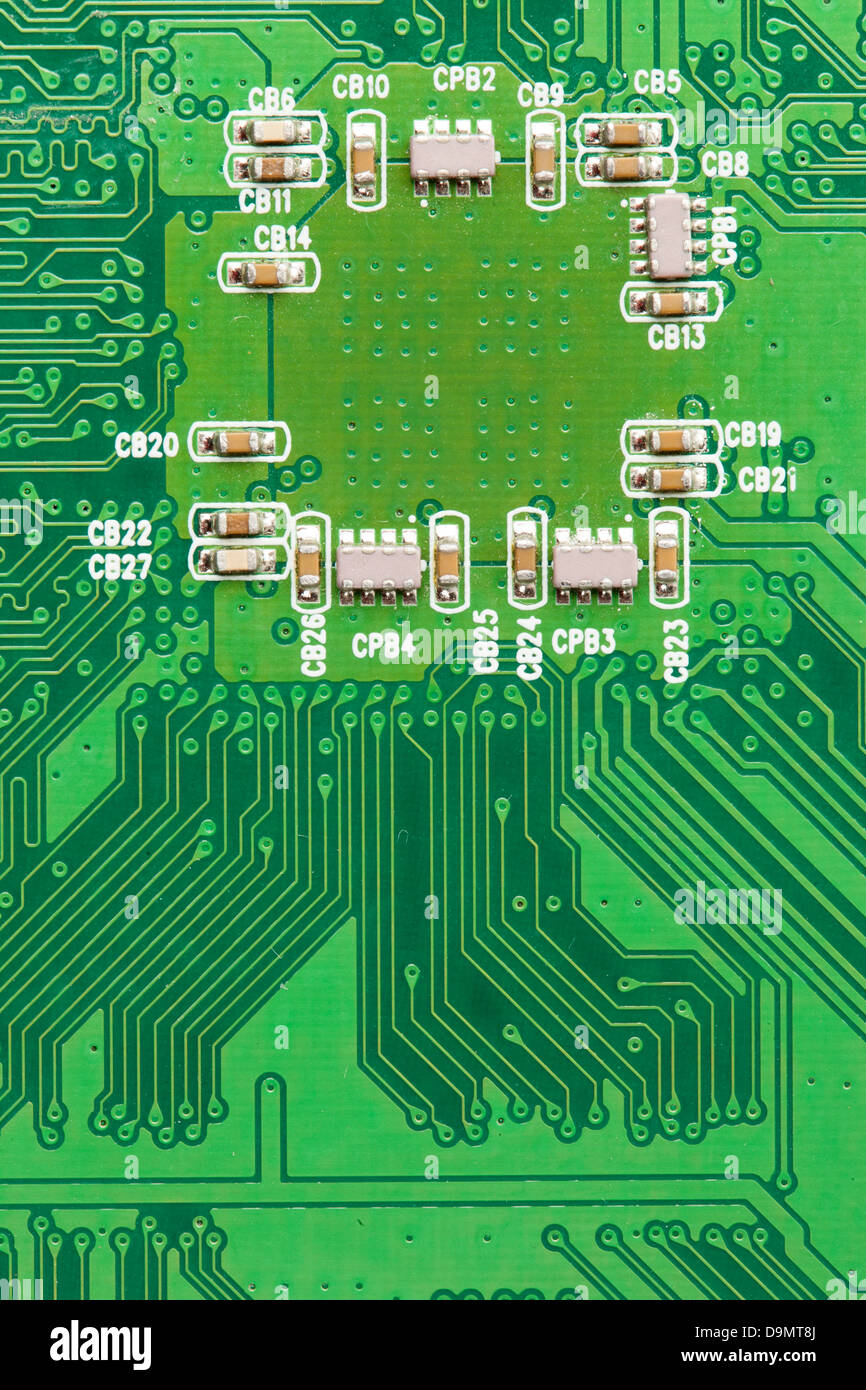 Green Electrical Circuit Board with microchips, conductors, and ...