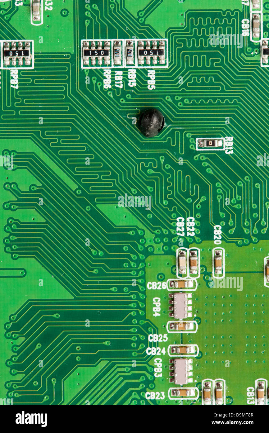 Green Electrical Circuit Board with microchips, conductors, and ...