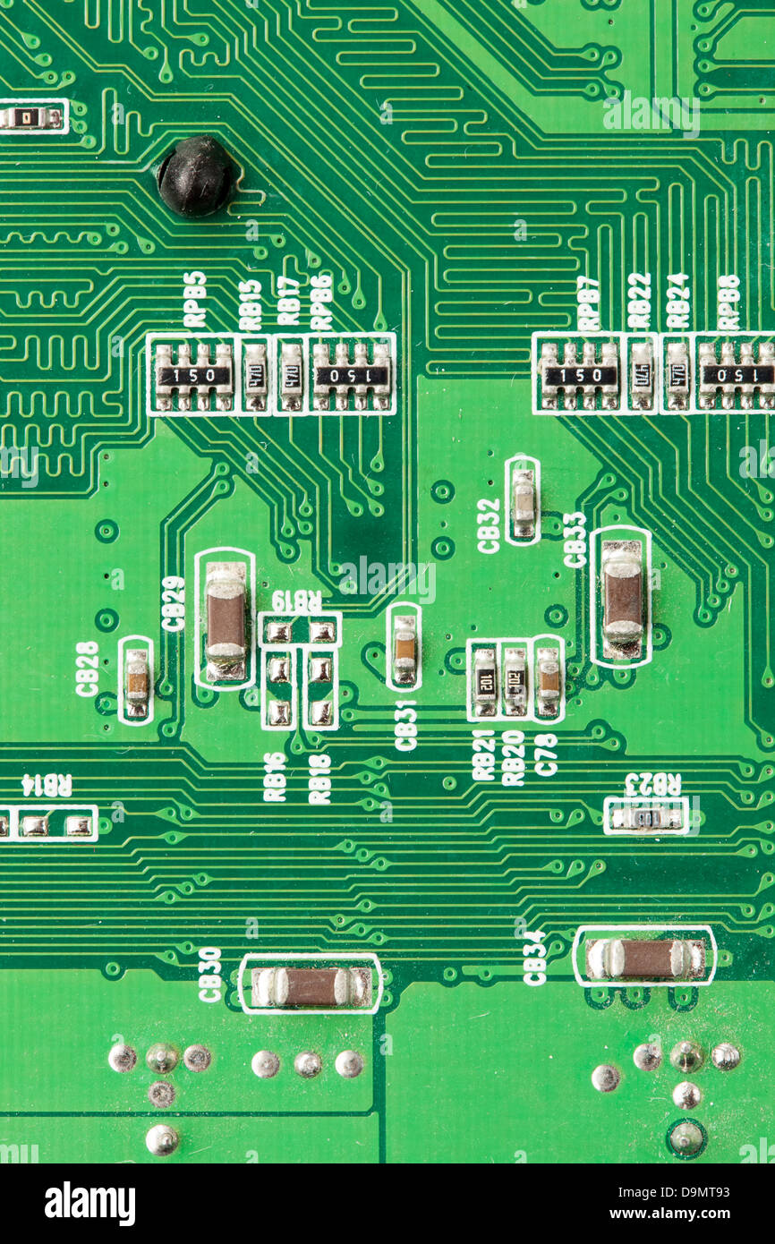 Green Electrical Circuit Board with microchips, conductors, and ...