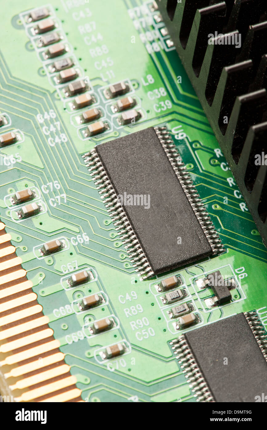 Green Electrical Circuit Board with microchips, conductors, and ...