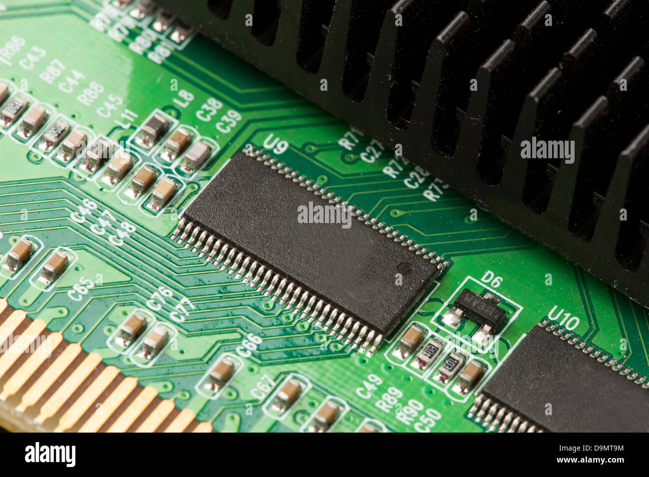 Green Electrical Circuit Board with microchips, conductors, and ...