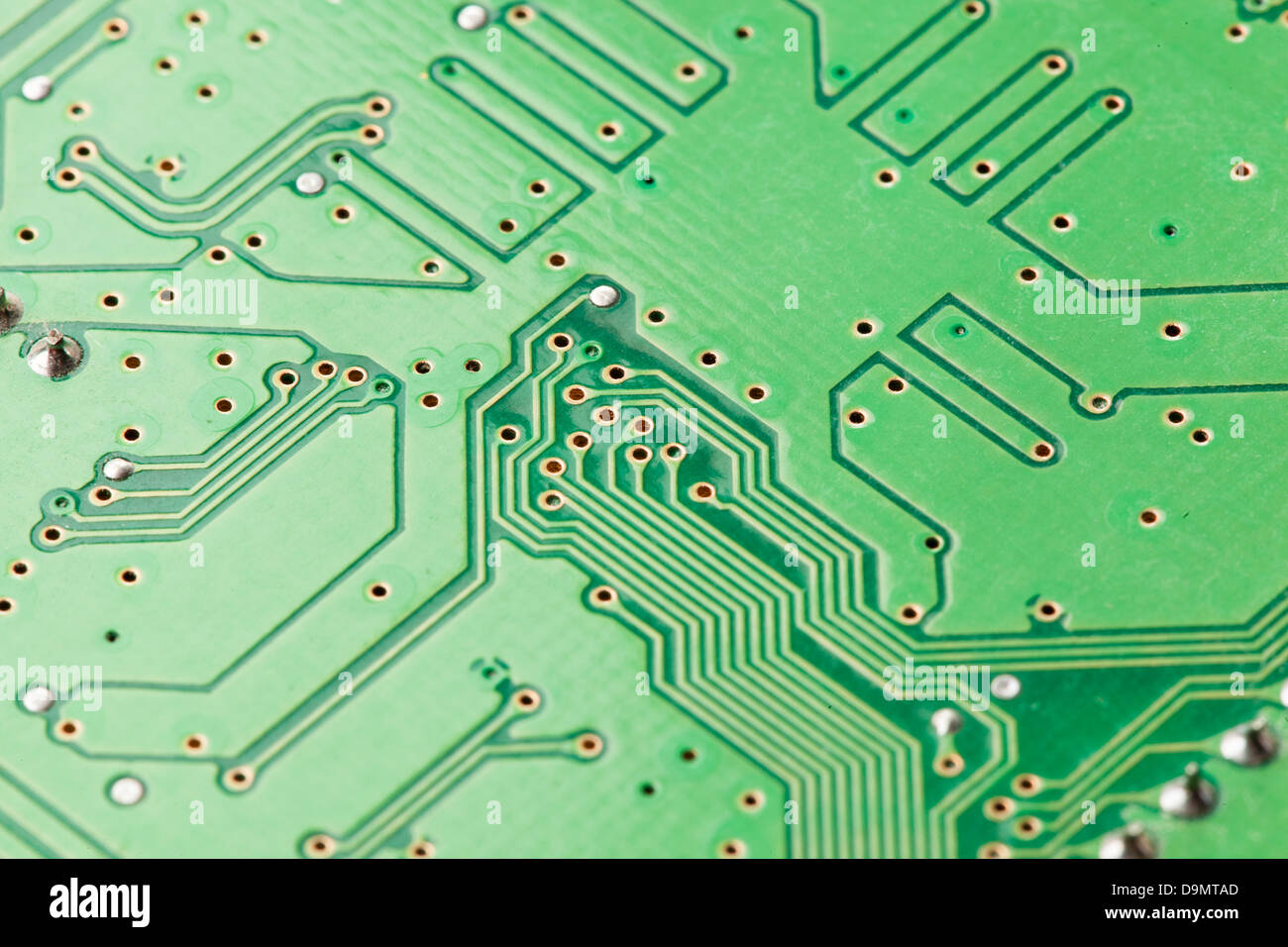 Green Electrical Circuit Board with microchips, conductors, and ...