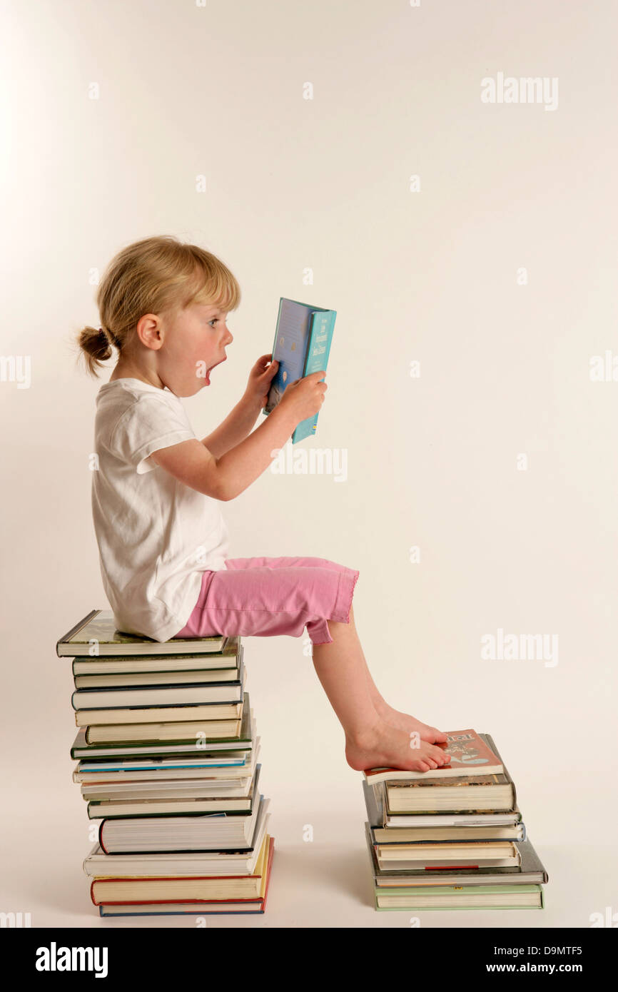 girl reading books and amazed by the content! - generic Stock Photo - Alamy