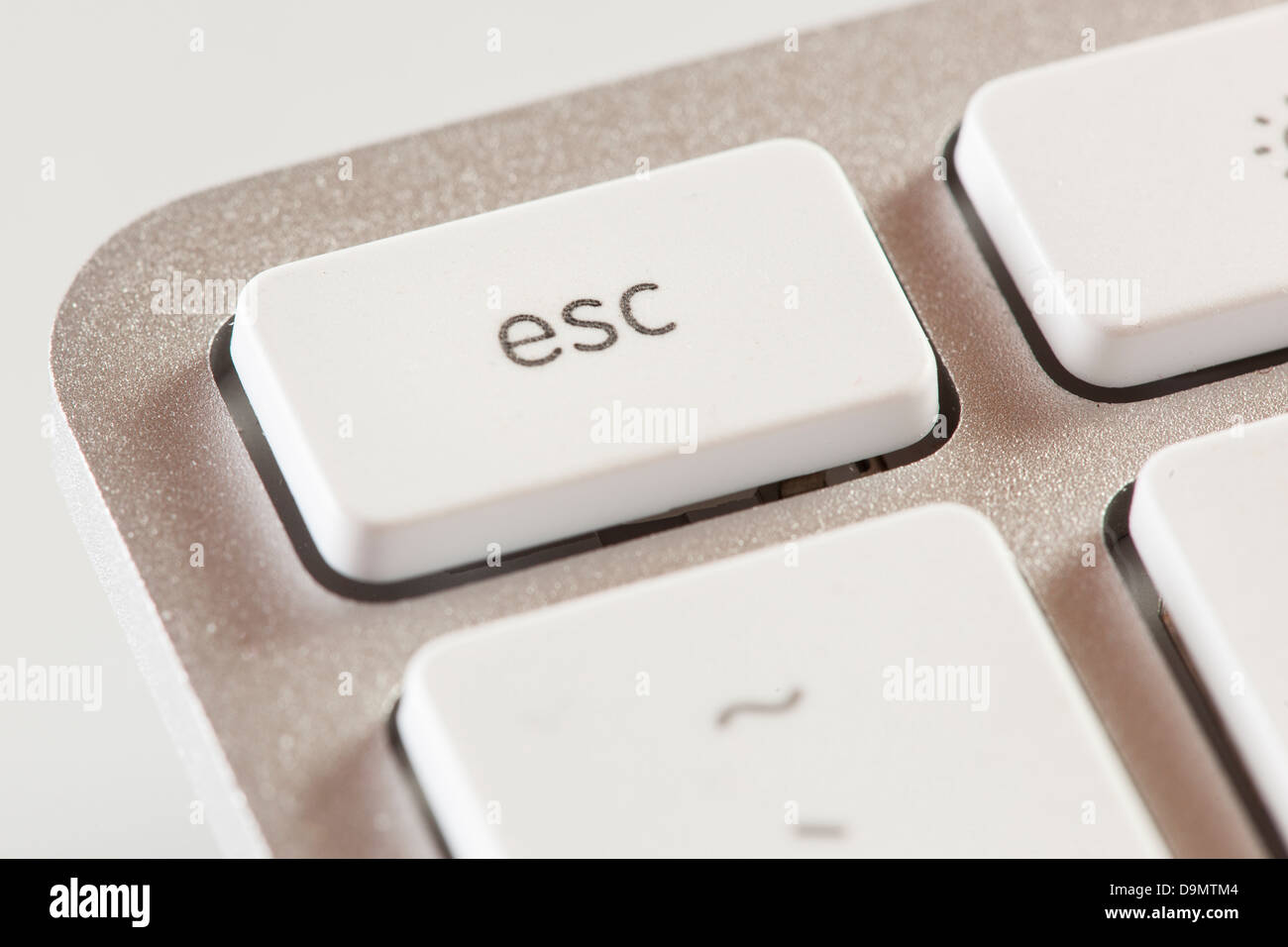 Escape Button on a Grey Computer Keyboard with white keys for typing ...