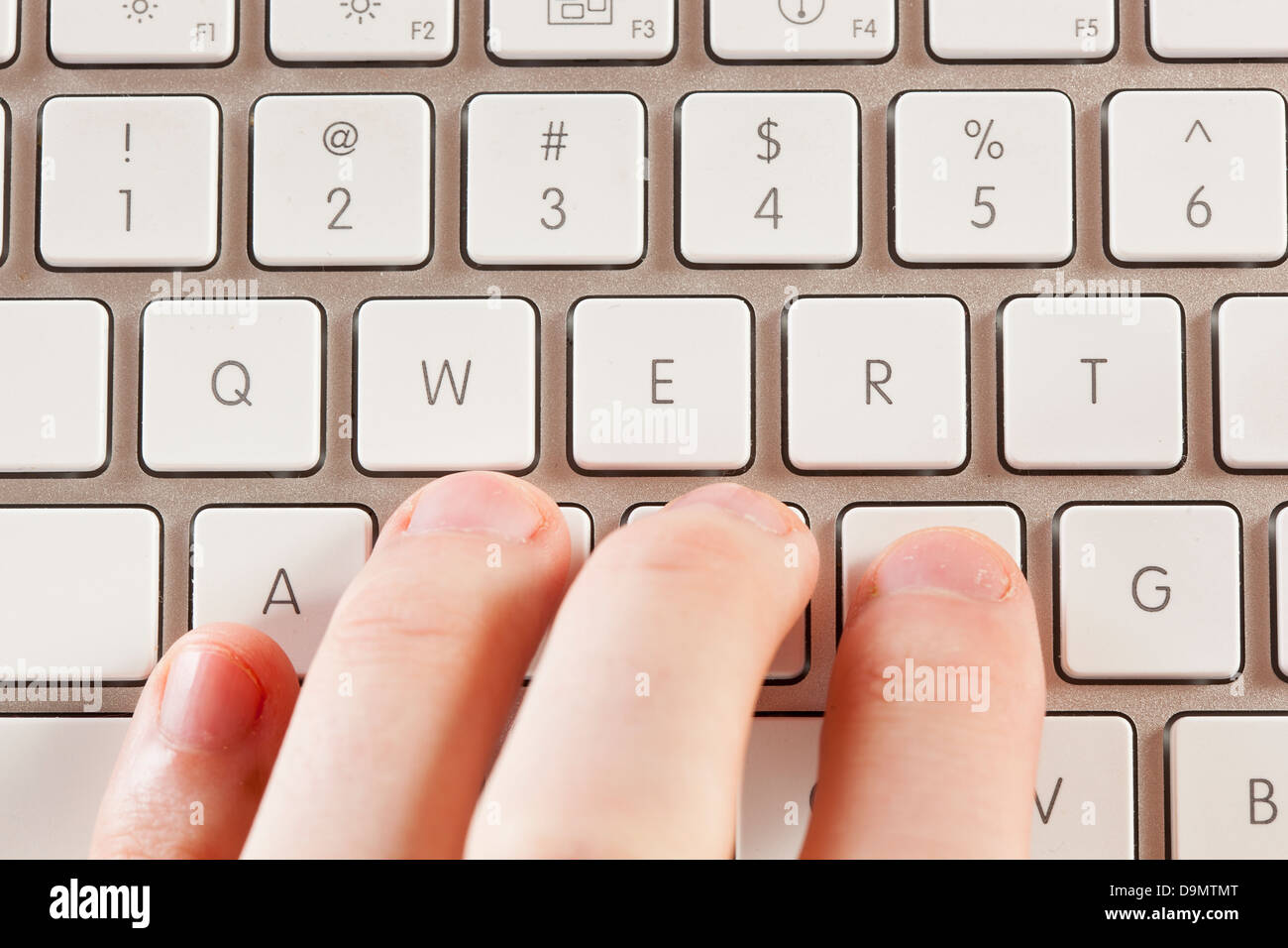 Fingers Typing on a white and grey computer keyboard Stock Photo - Alamy