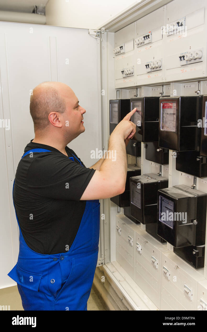 Electrician in the switch cupboard (model release Stock Photo - Alamy