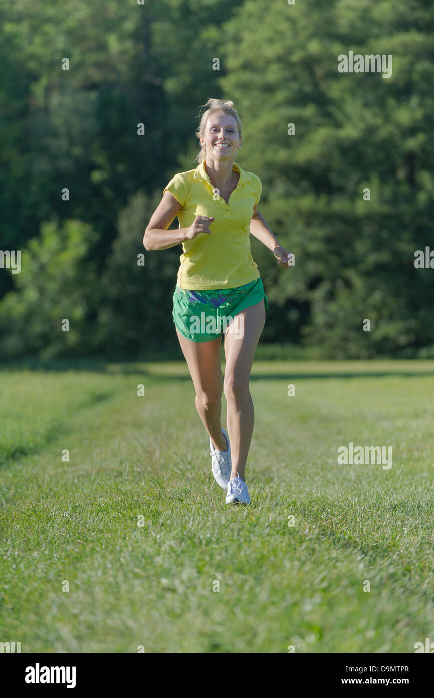 Attractive woman jogging (model release Stock Photo - Alamy