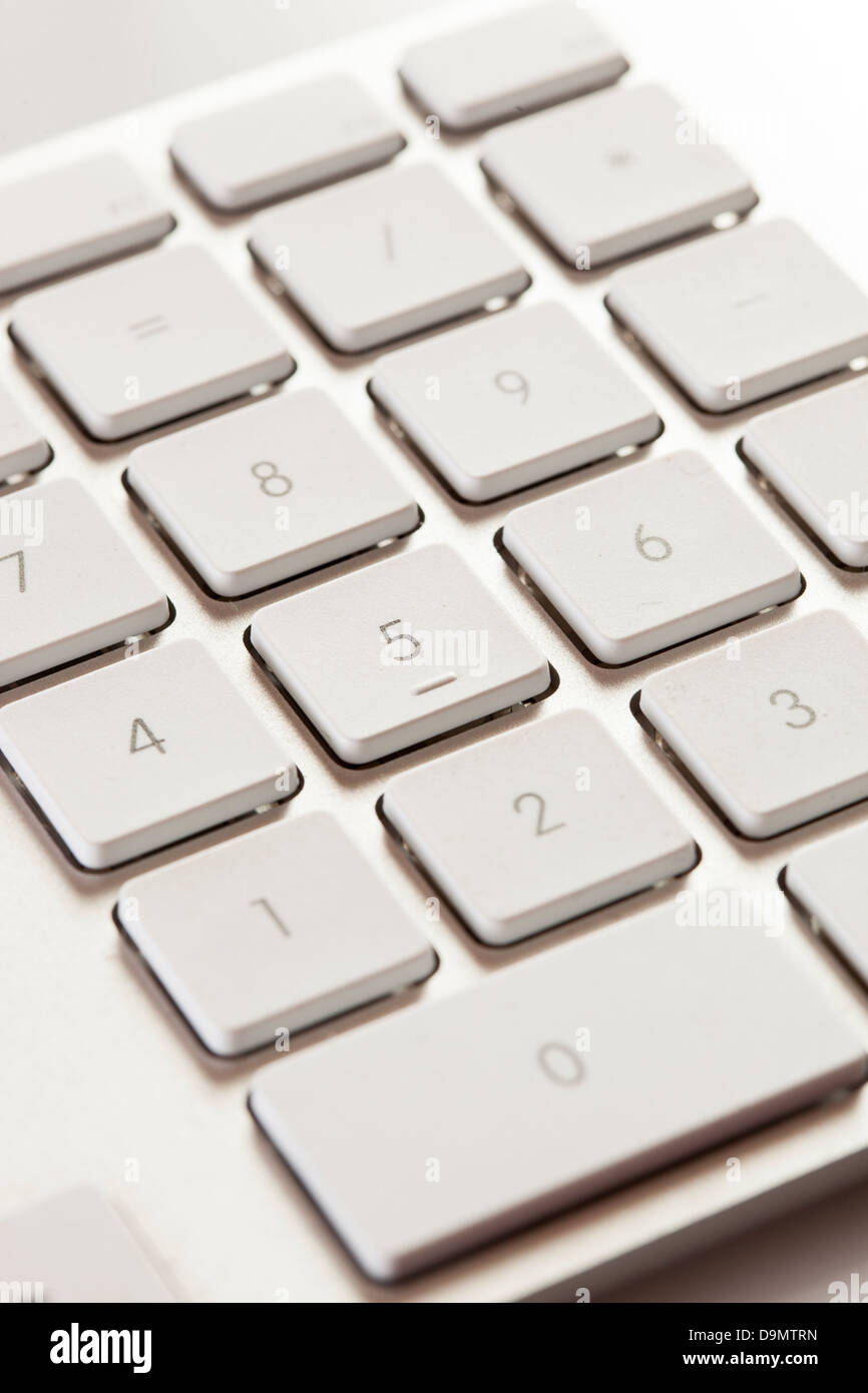 Number Keypad on a Grey Computer Keyboard with white keys for typing ...