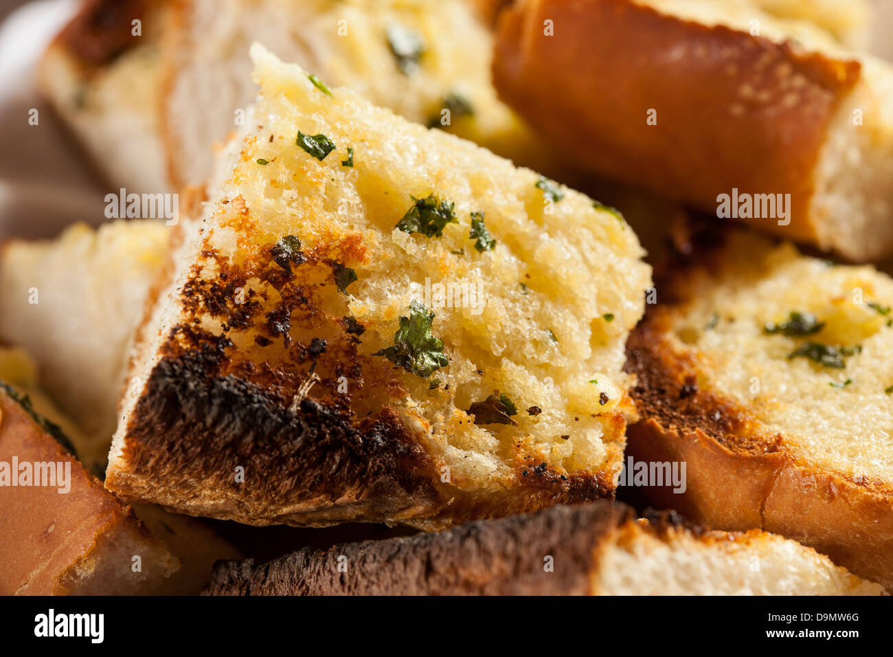 Homemade Crunchy Garlic Bread with butter and parsley Stock Photo - Alamy
