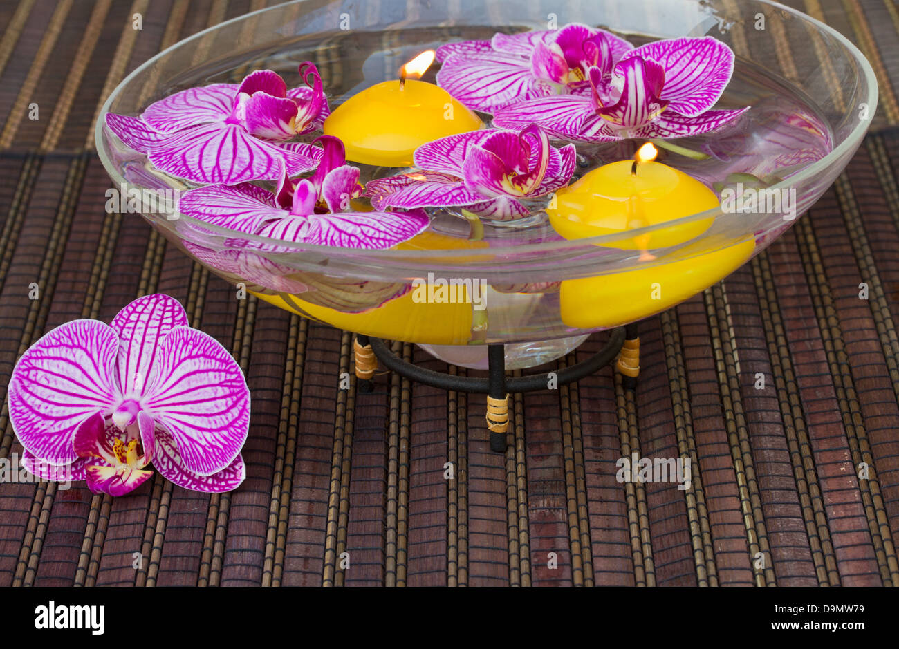 set for spa with candles and flowers Stock Photo - Alamy