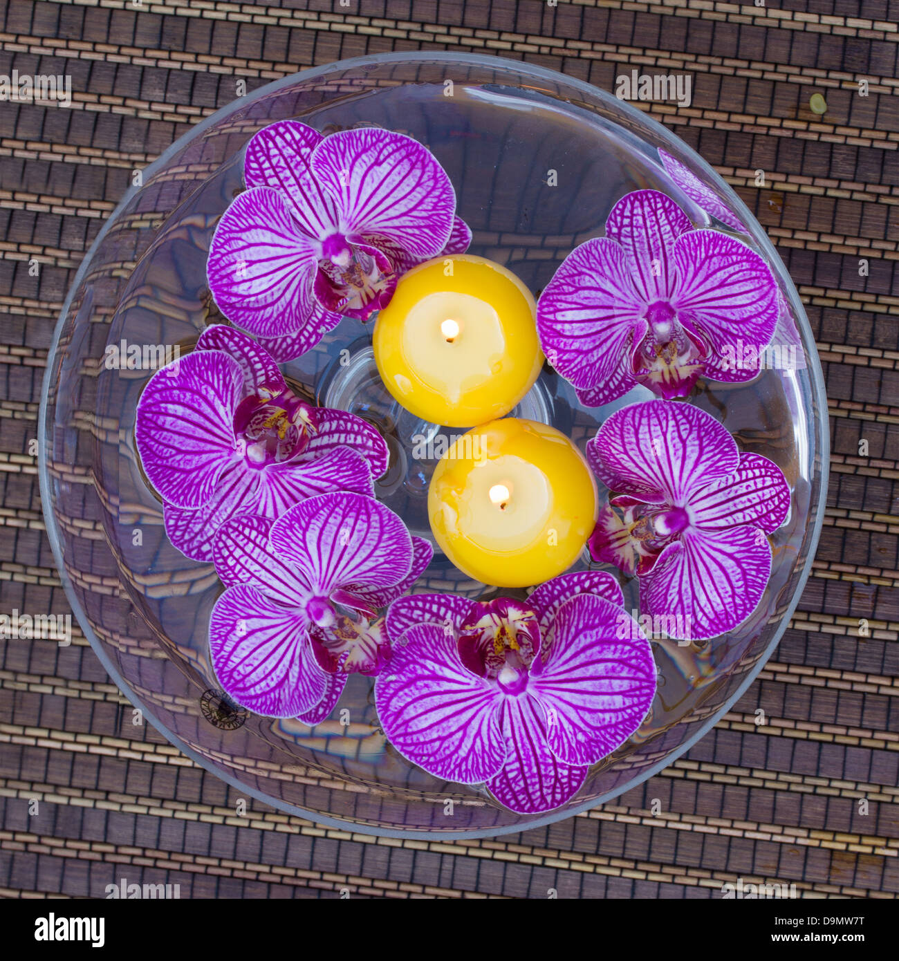 spa with floating flowers and candles Stock Photo - Alamy