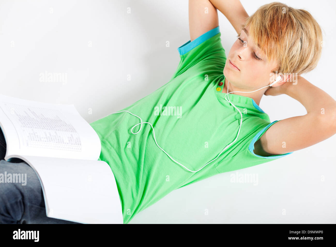teen boy reading book Stock Photo - Alamy