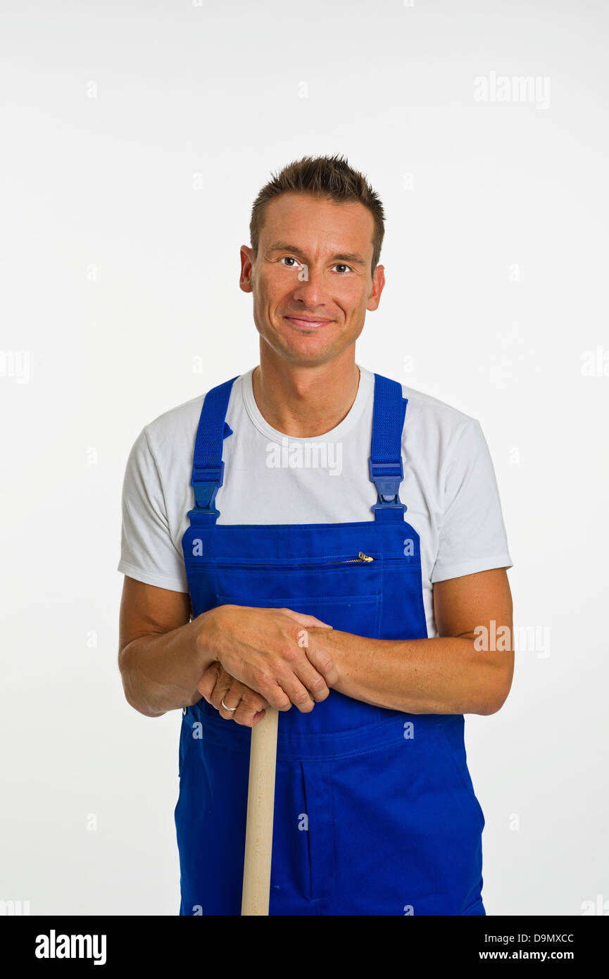 Construction worker with spavins, spade (Model release Stock Photo - Alamy