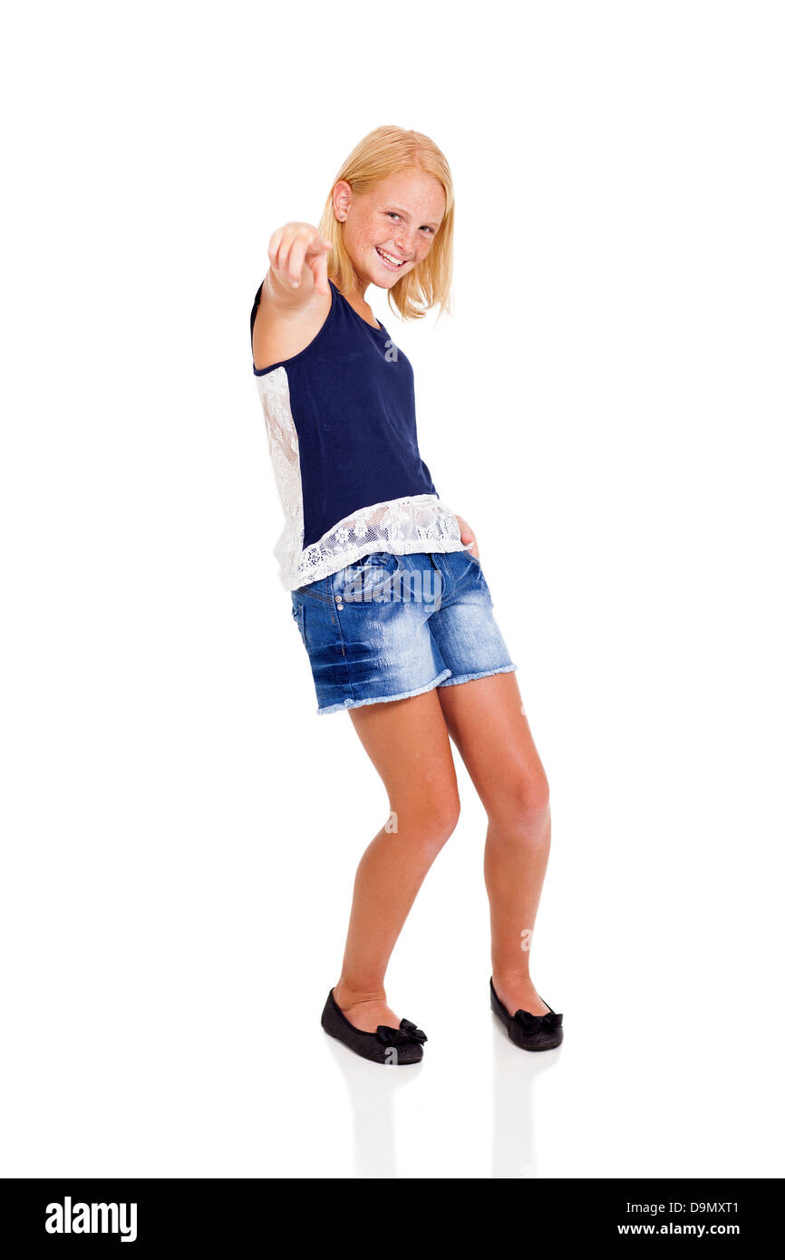 cute teenage girl pointing on white background Stock Photo - Alamy