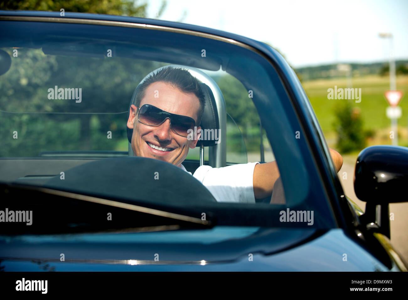 Man in cabriolet car wind hi-res stock photography and images - Alamy