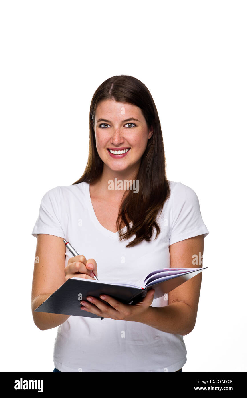 (Model release) Young woman holds a notebook Stock Photo - Alamy