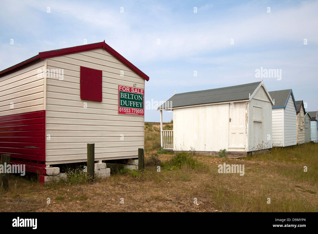 Wood panelled painted changing huts on Heacham North Beach Beach hut or ...