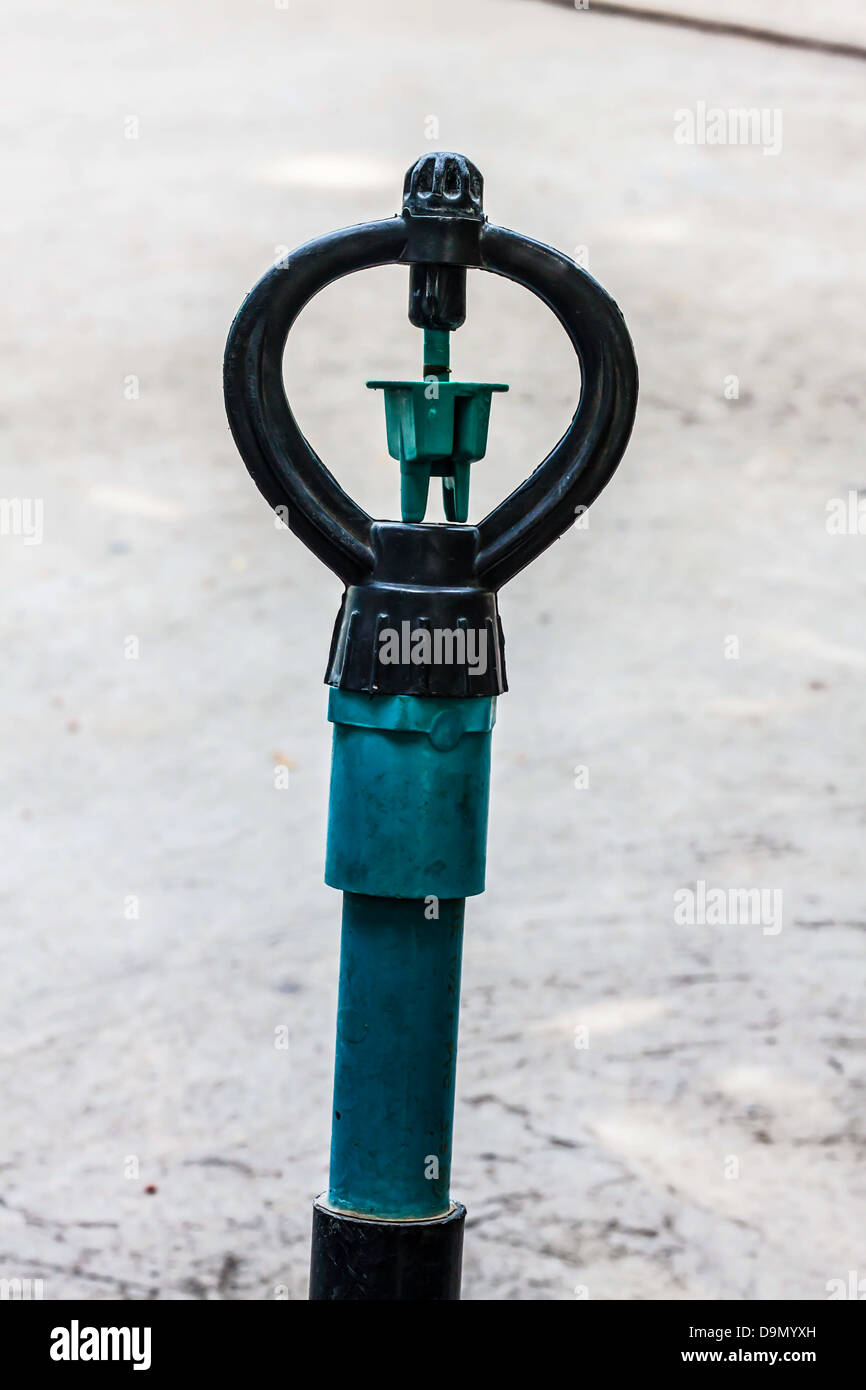 The blue plastic sprinkler Stock Photo - Alamy