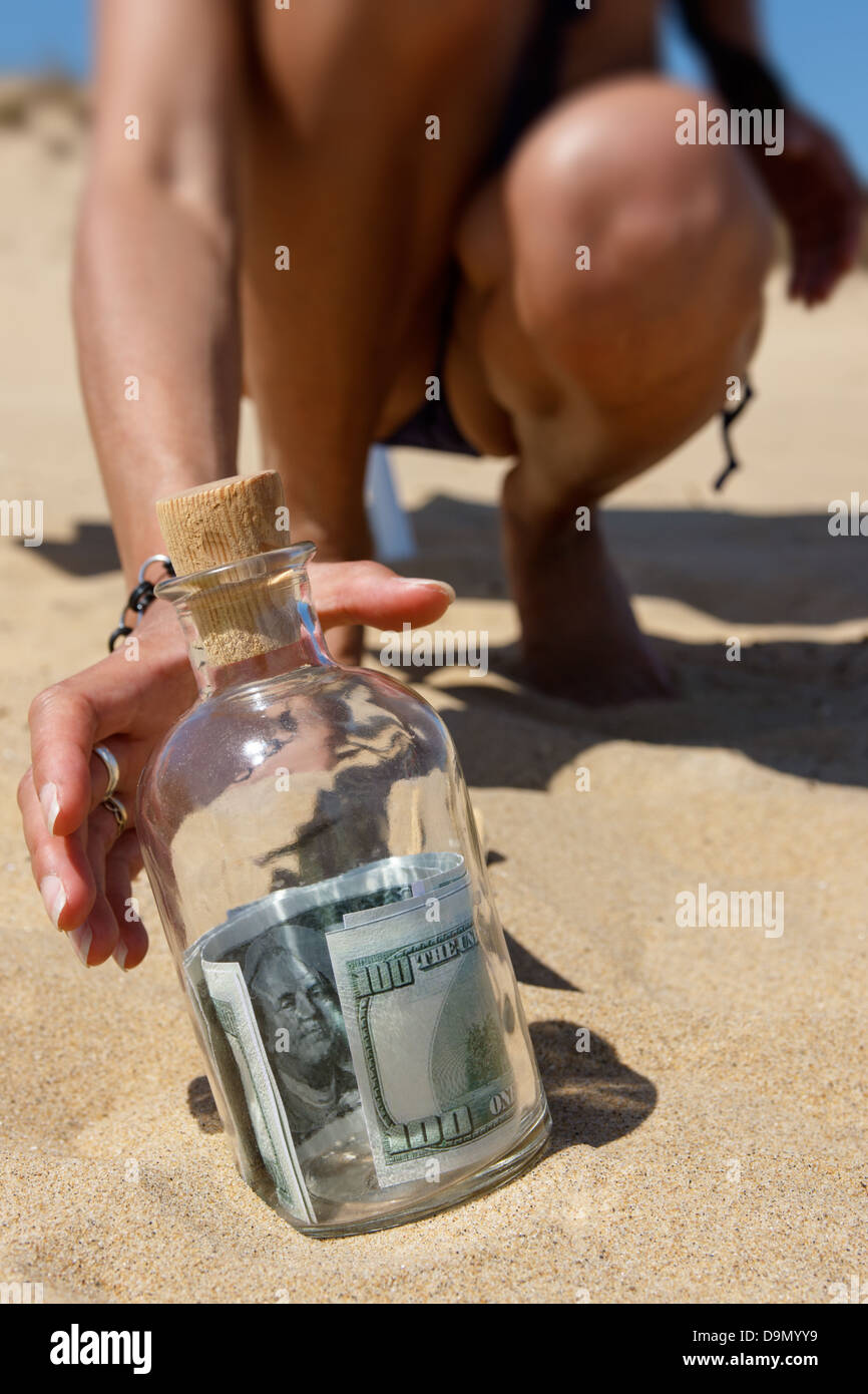Money in a bottle Stock Photo - Alamy