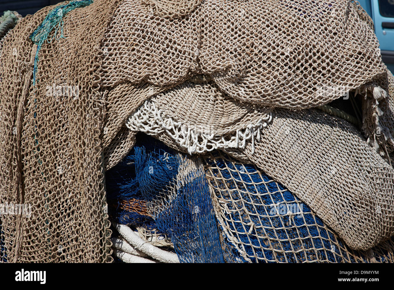 pile of small mesh fishing nets in the port harbour of Cambrils ...
