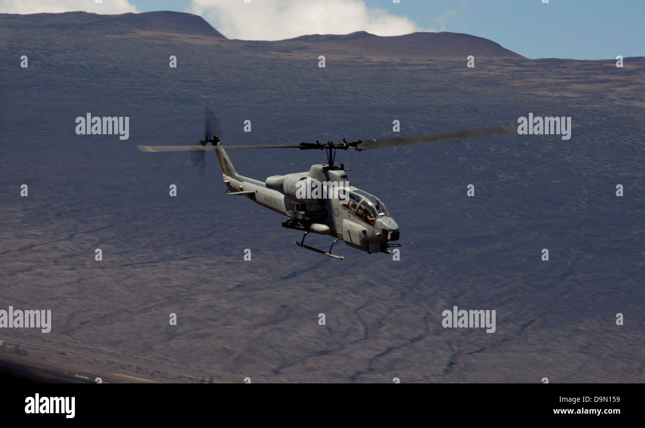 A US Marine Corps AH-1W Super Cobra attack helicopter during a live ...