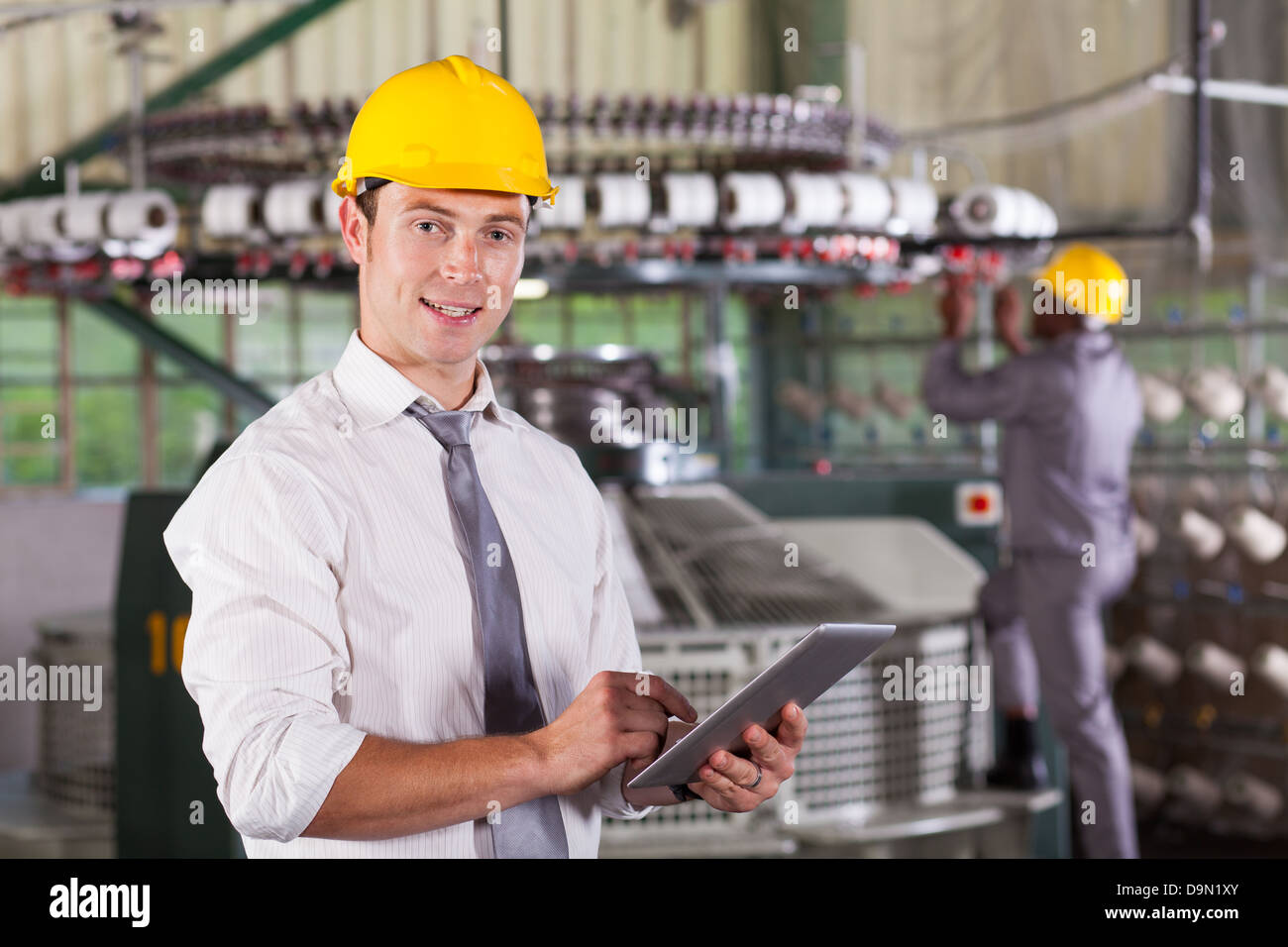 modern textile factory manager using tablet computer Stock Photo - Alamy