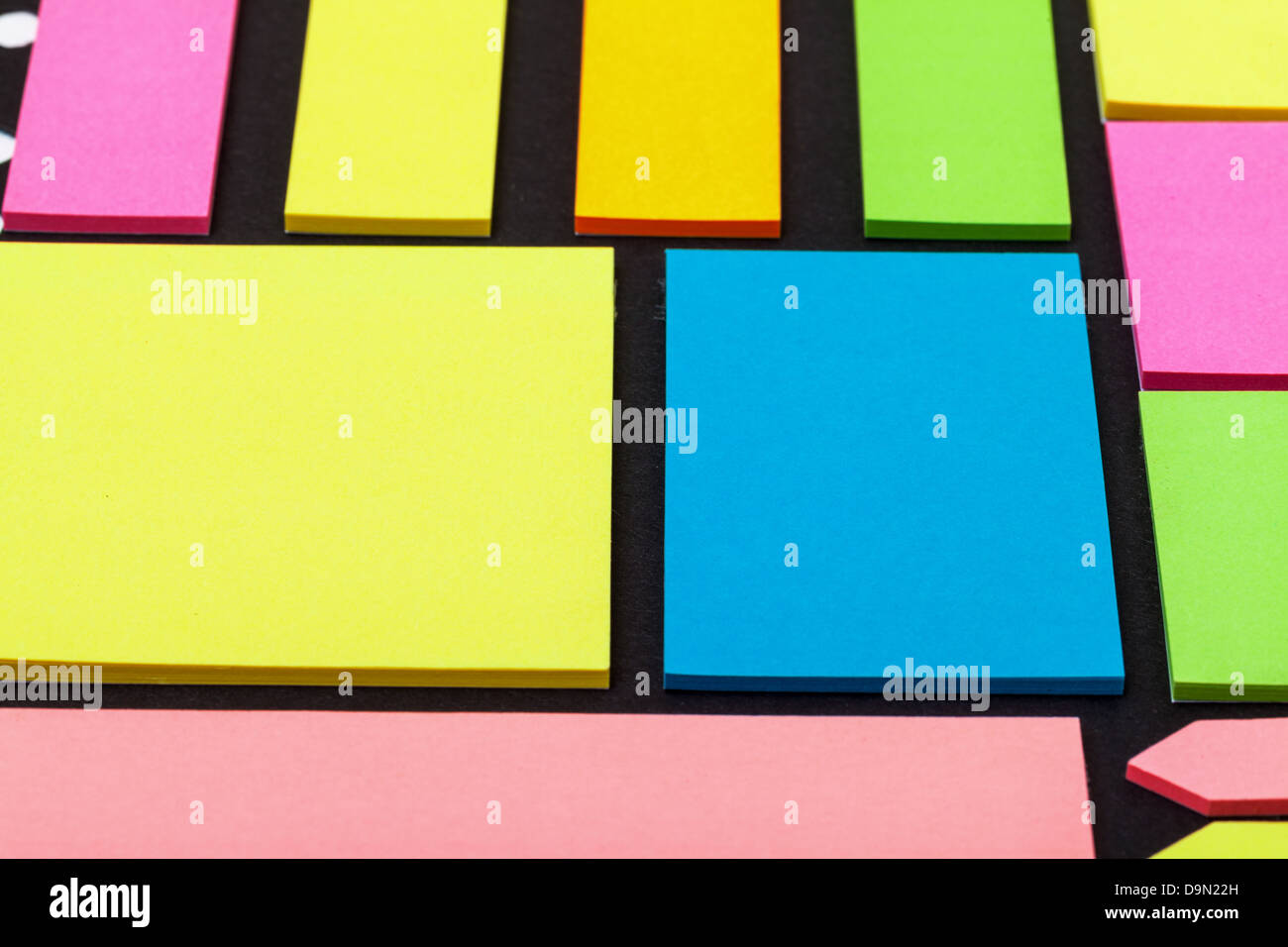 Set of multicolored paper sticky stickers, on black paper Stock Photo ...
