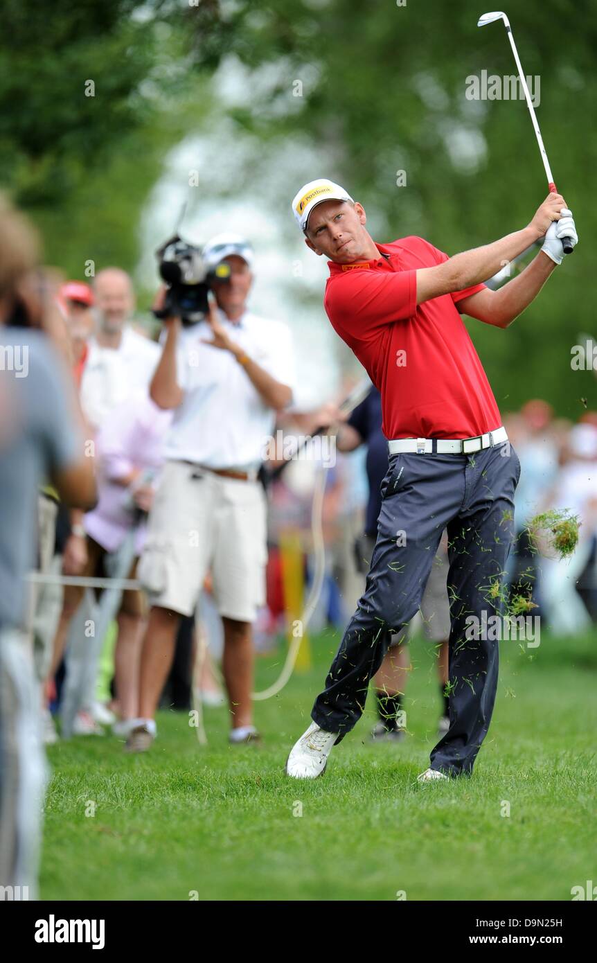 Munick, Germany. 23 June 2013. German golf pro Marcel Siem hits the ...